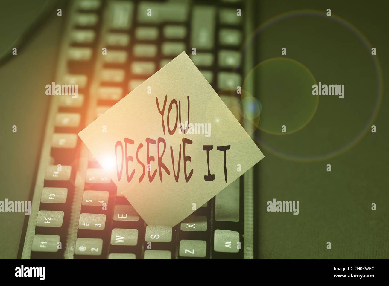 Hand writing sign You Deserve It. Concept meaning should have it ...