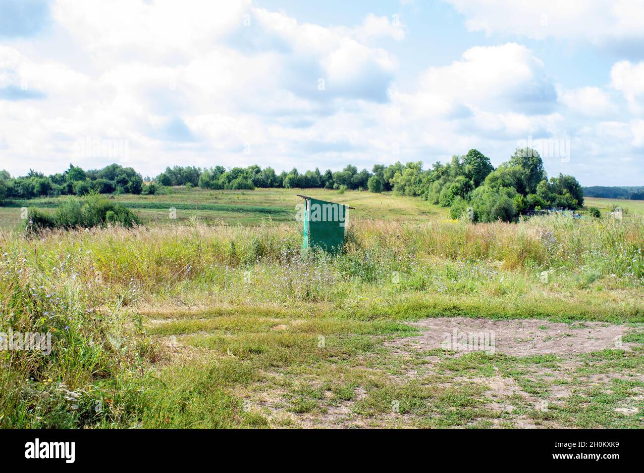 rural wooden toilet in the field, in summer Stock Photo - Alamy