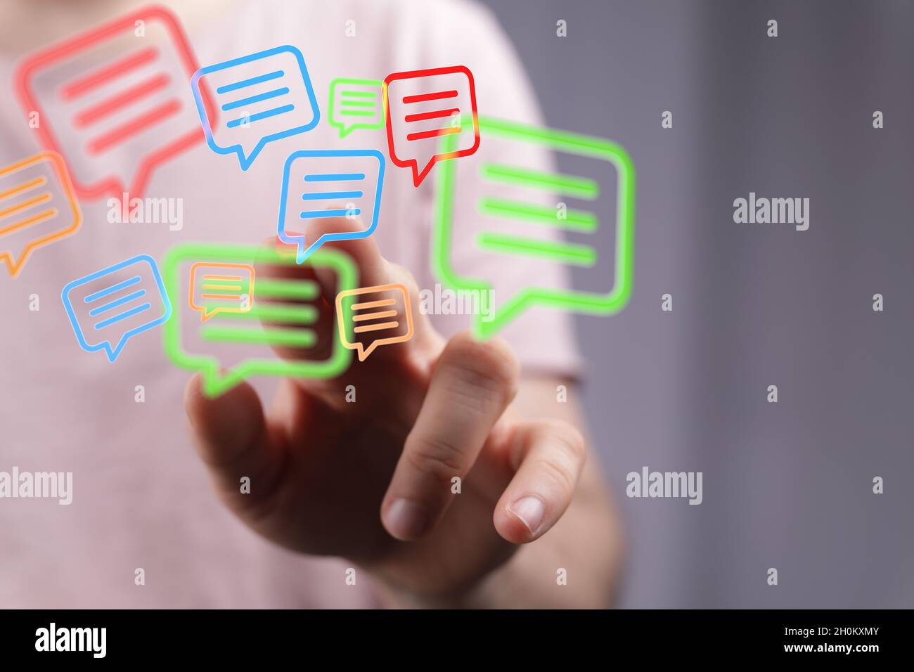3D rendering of a man pointing at floating colorful email icons ...