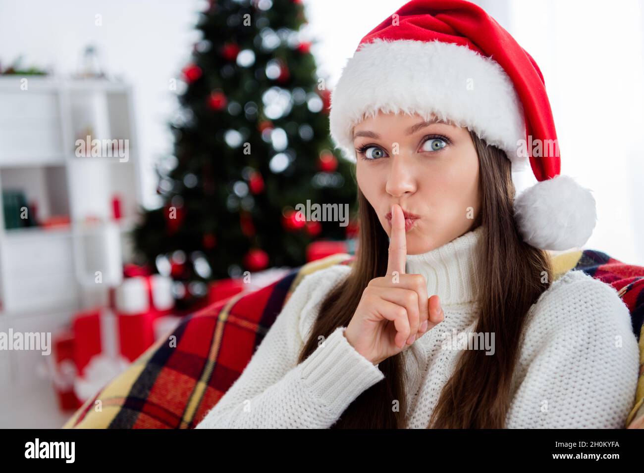 Photo of mute happy positive young woman hold finger lips celebrate ...