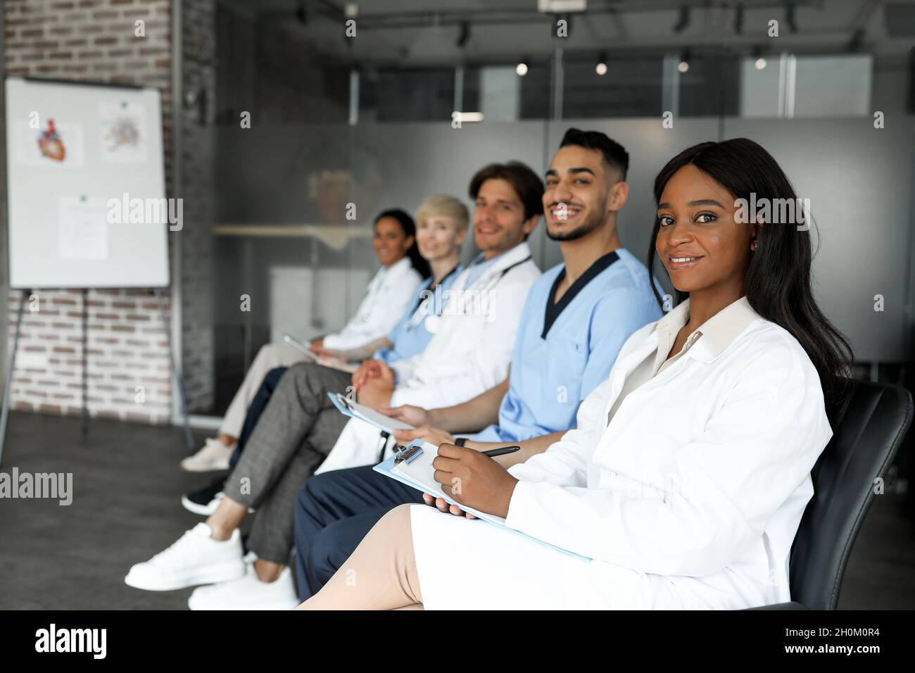 Multiethnic doctors having medical conference hi-res stock photography ...