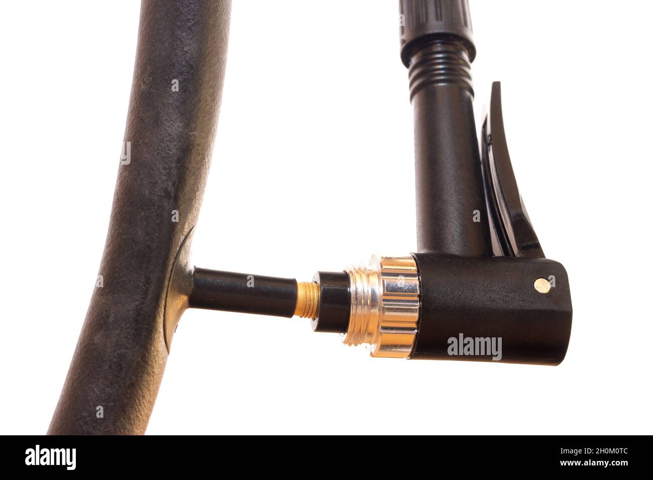 Close-up view of a pump blowing air into a valve of inner tube Stock ...