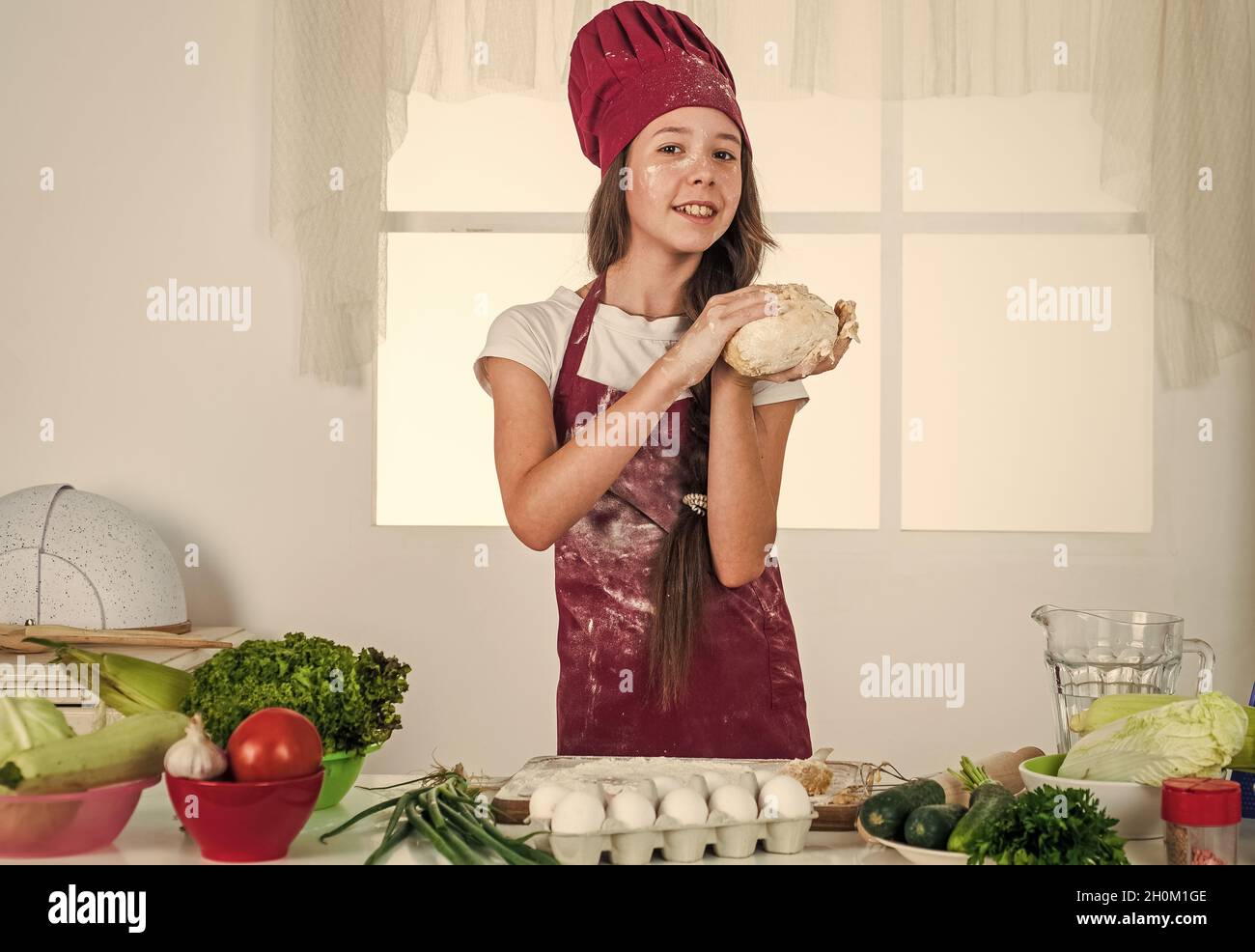 child girl cooking meal from healthy and organic products only Stock ...