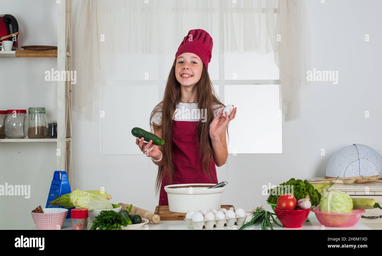 Food in your budget. kid chef cooking with cucumber and egg. child ...