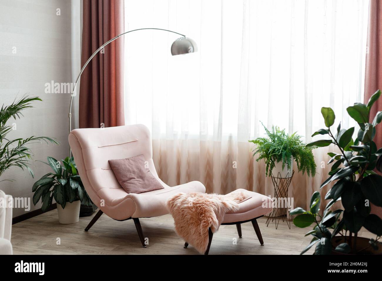 Stylish room interior with Cozy empty armchair near window gray wall ...