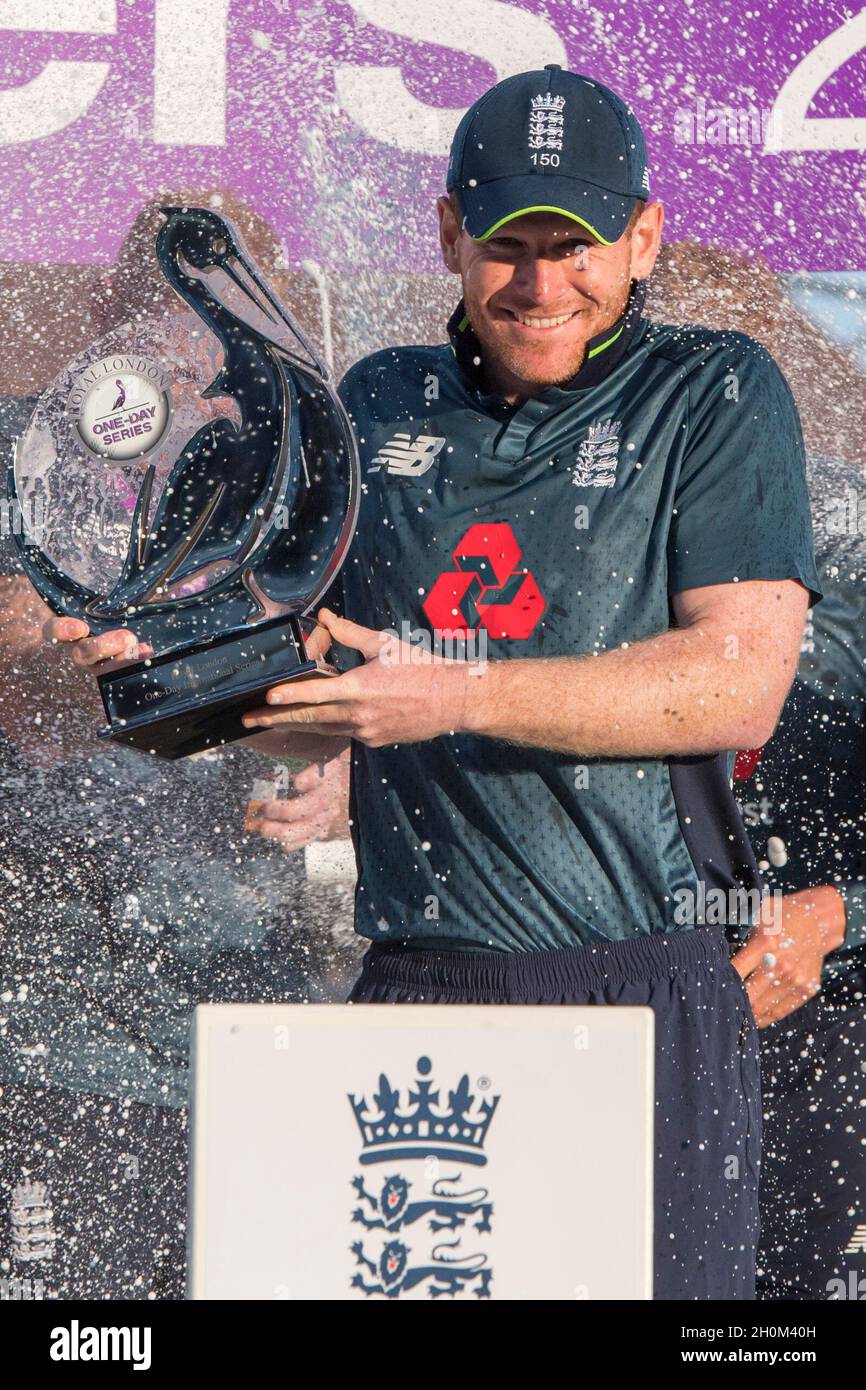 England’s captain Eoin Morgan is presented with the series trophy ...
