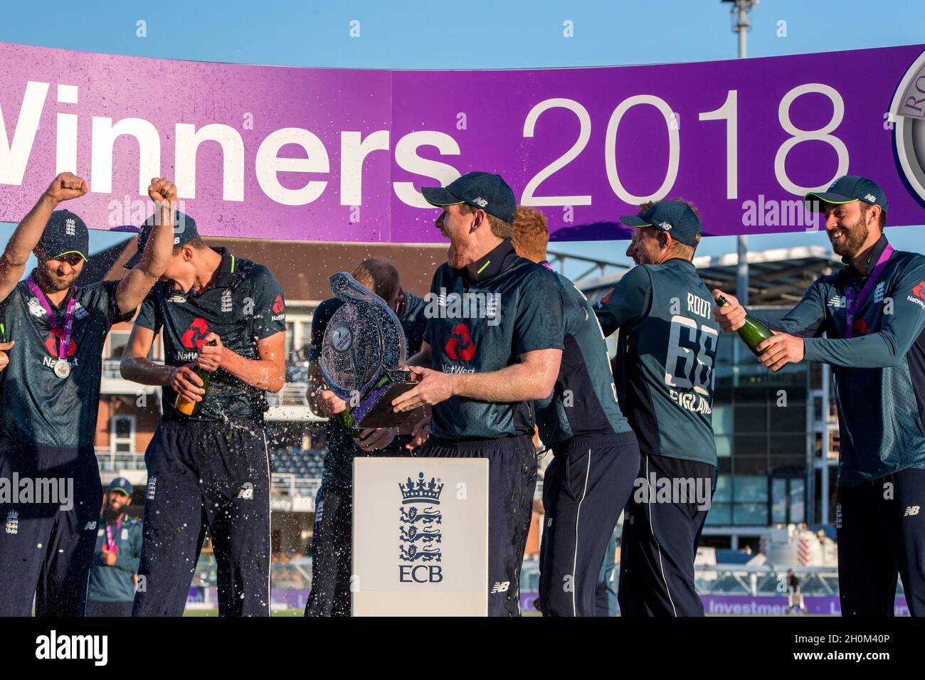 England’s captain Eoin Morgan is presented with the series trophy ...