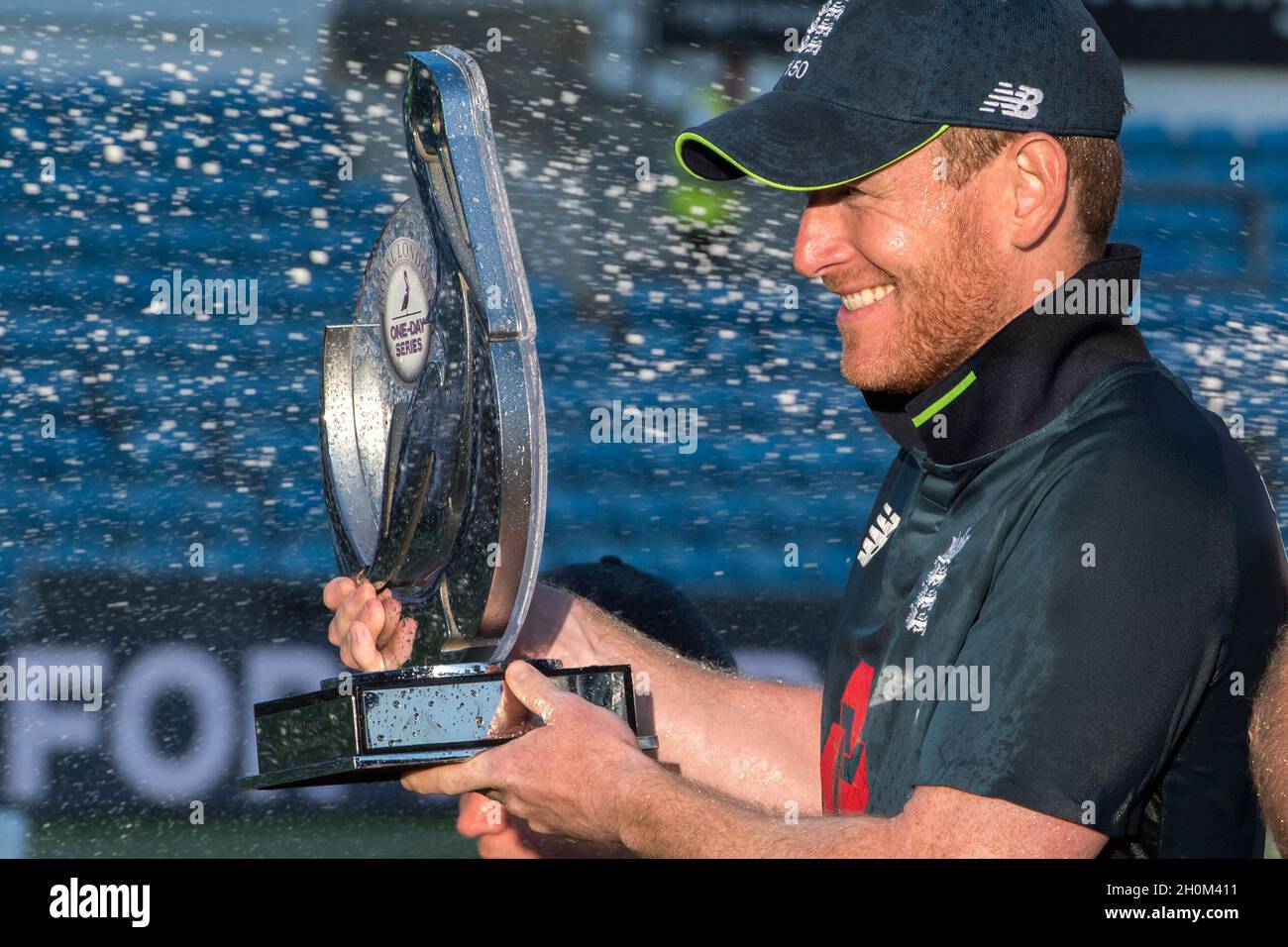 England’s captain Eoin Morgan is presented with the series trophy ...