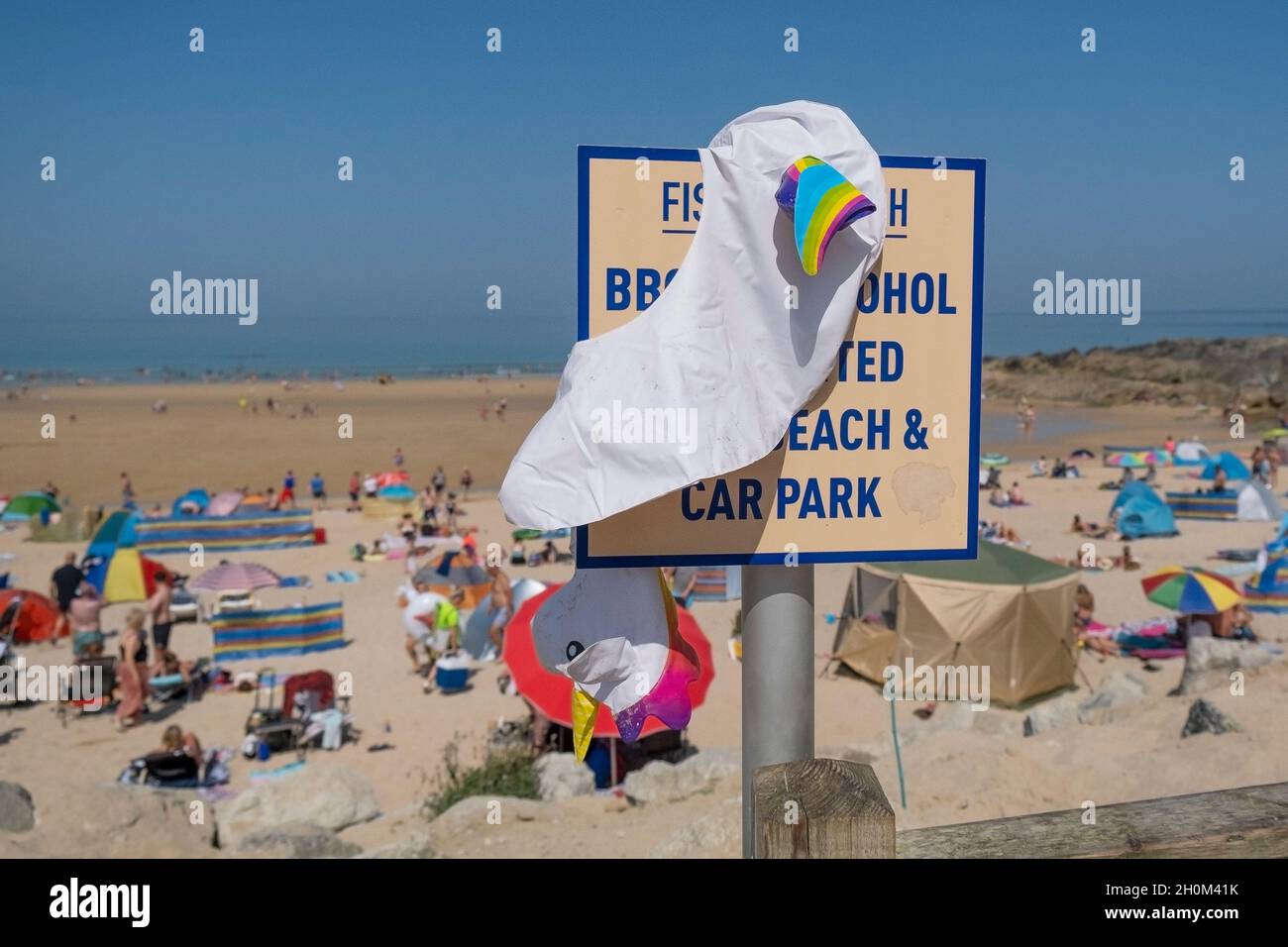 A broken and discarded plastic beach novelty carelessly draped on a ...