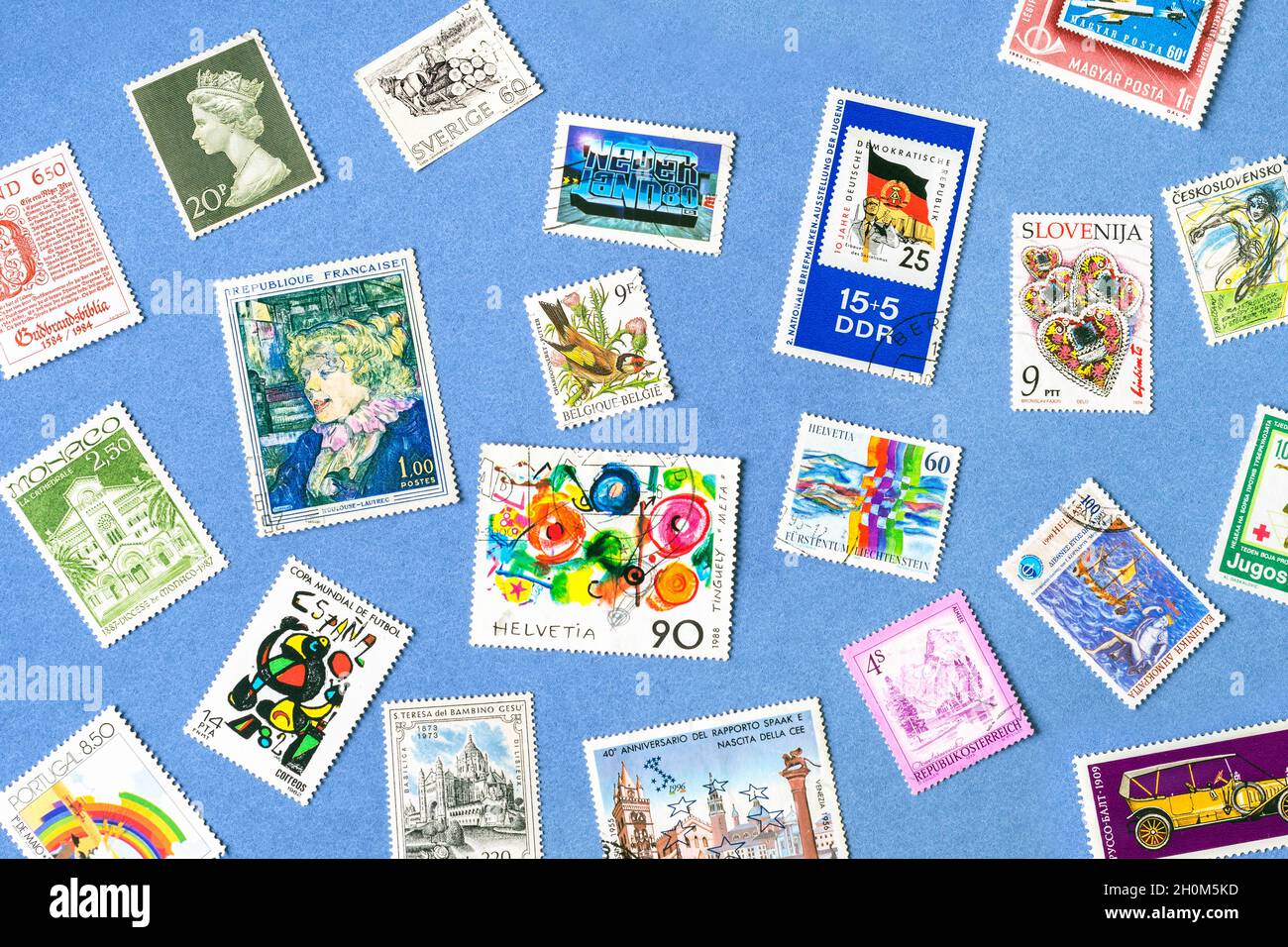 Various postage stamps from around the world on blue background Stock ...