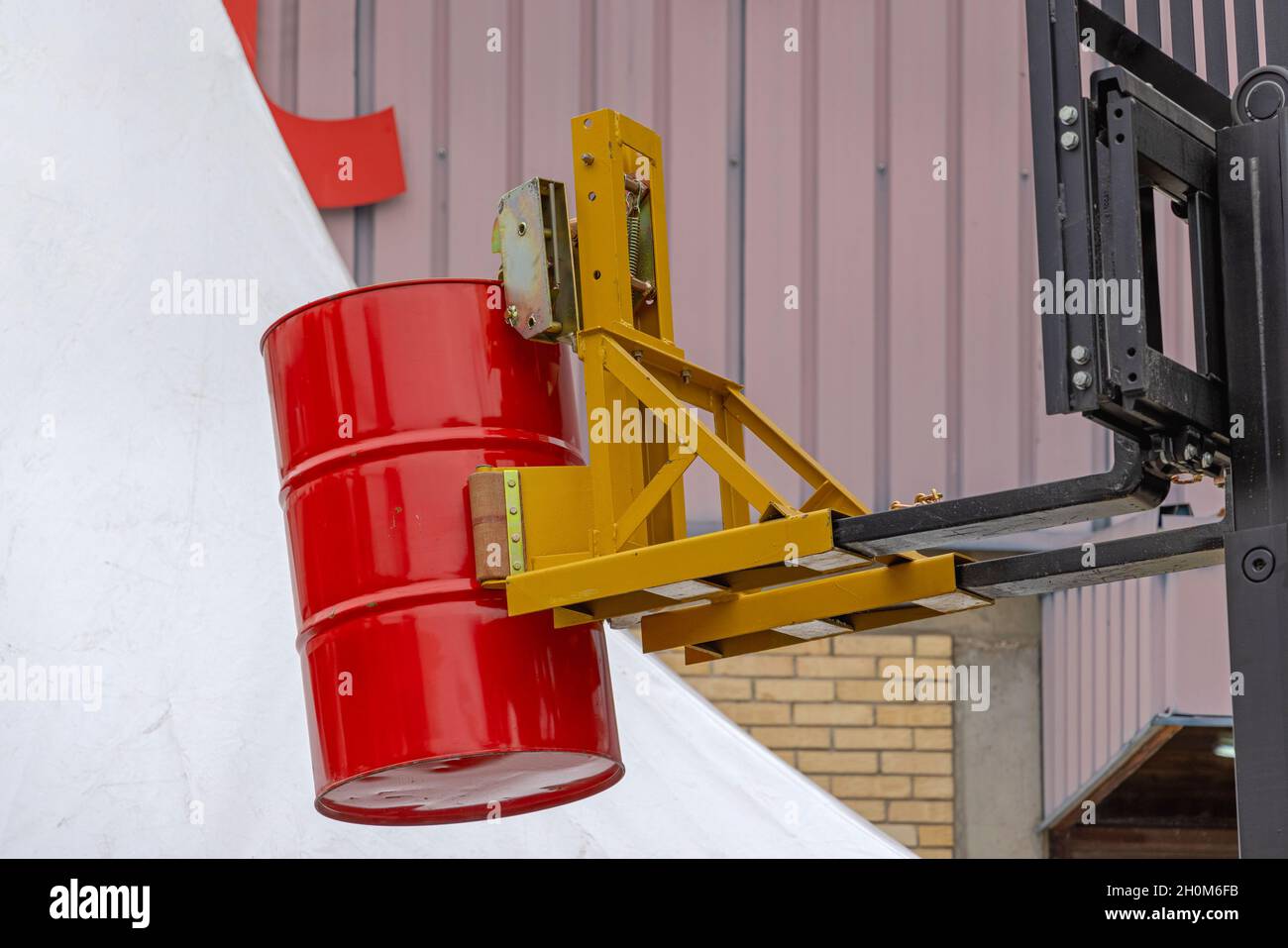 Oil Drum Grabber at Forklift Truck Attachment Device Stock Photo - Alamy