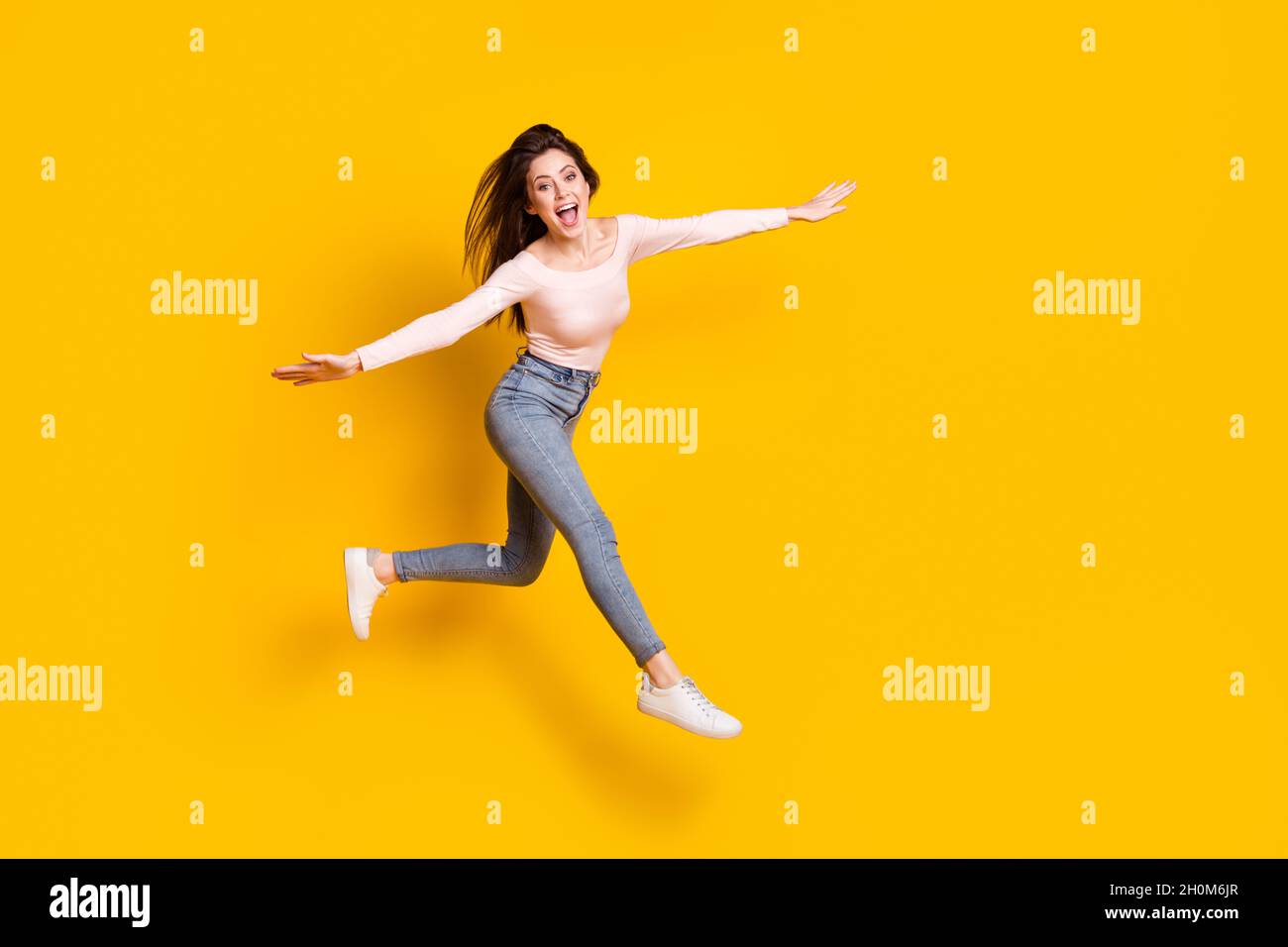 Full size photo of young happy excited smiling girl flying hold hands ...
