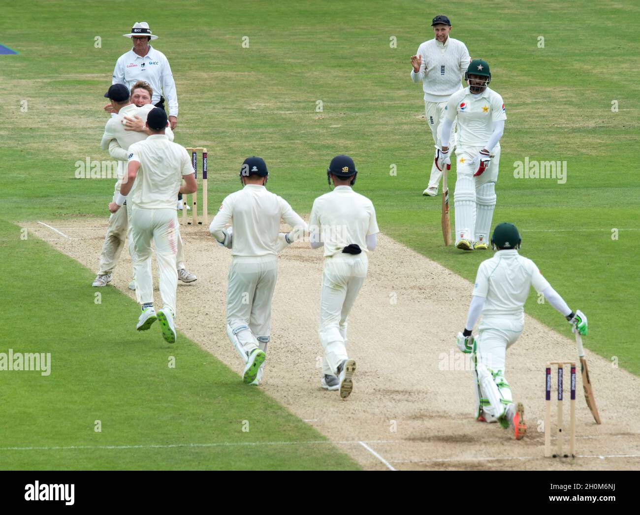 England’s Dominic Bess celebrates taking the wicket of Pakistan’s Azhar ...