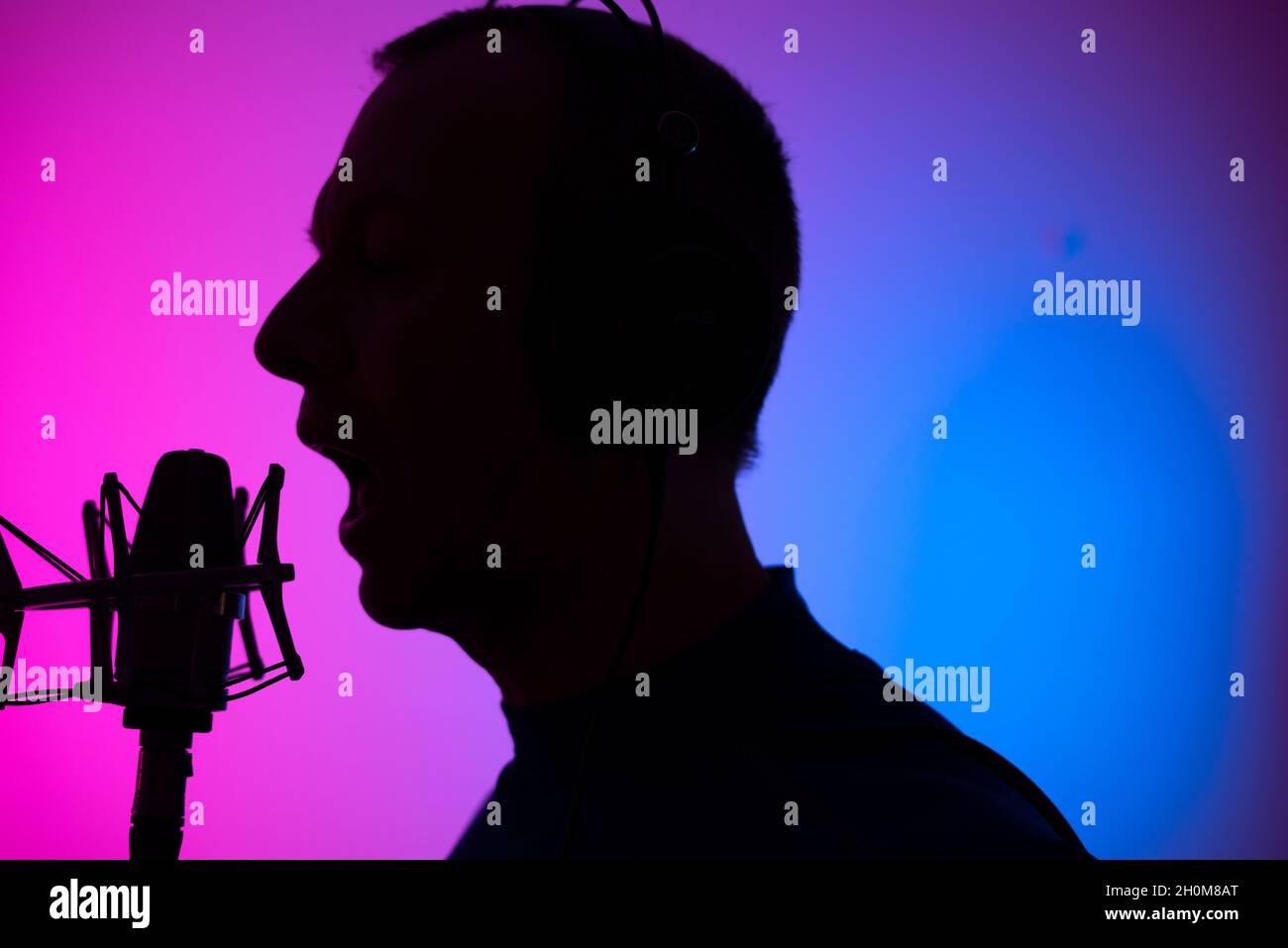 Voice over artist in booth hi-res stock photography and images - Alamy