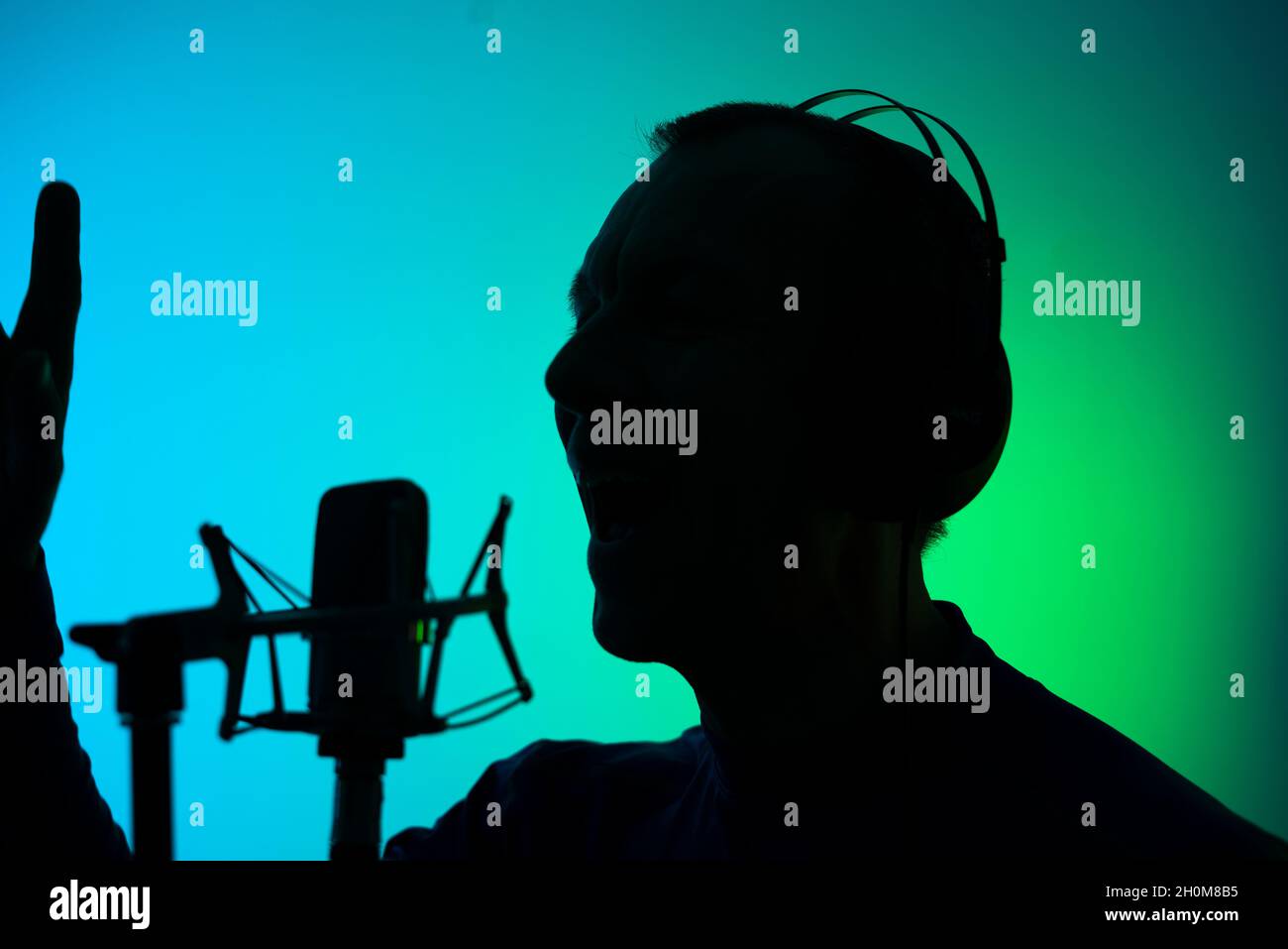 Voice over artist in booth hi-res stock photography and images - Alamy