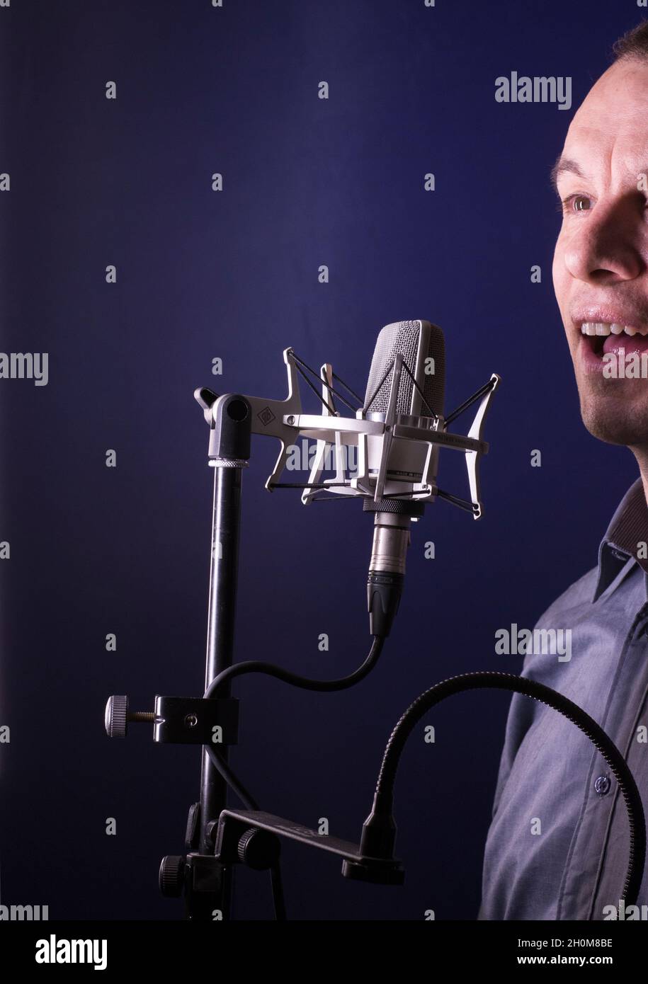 Voice over artist in booth hi-res stock photography and images - Alamy