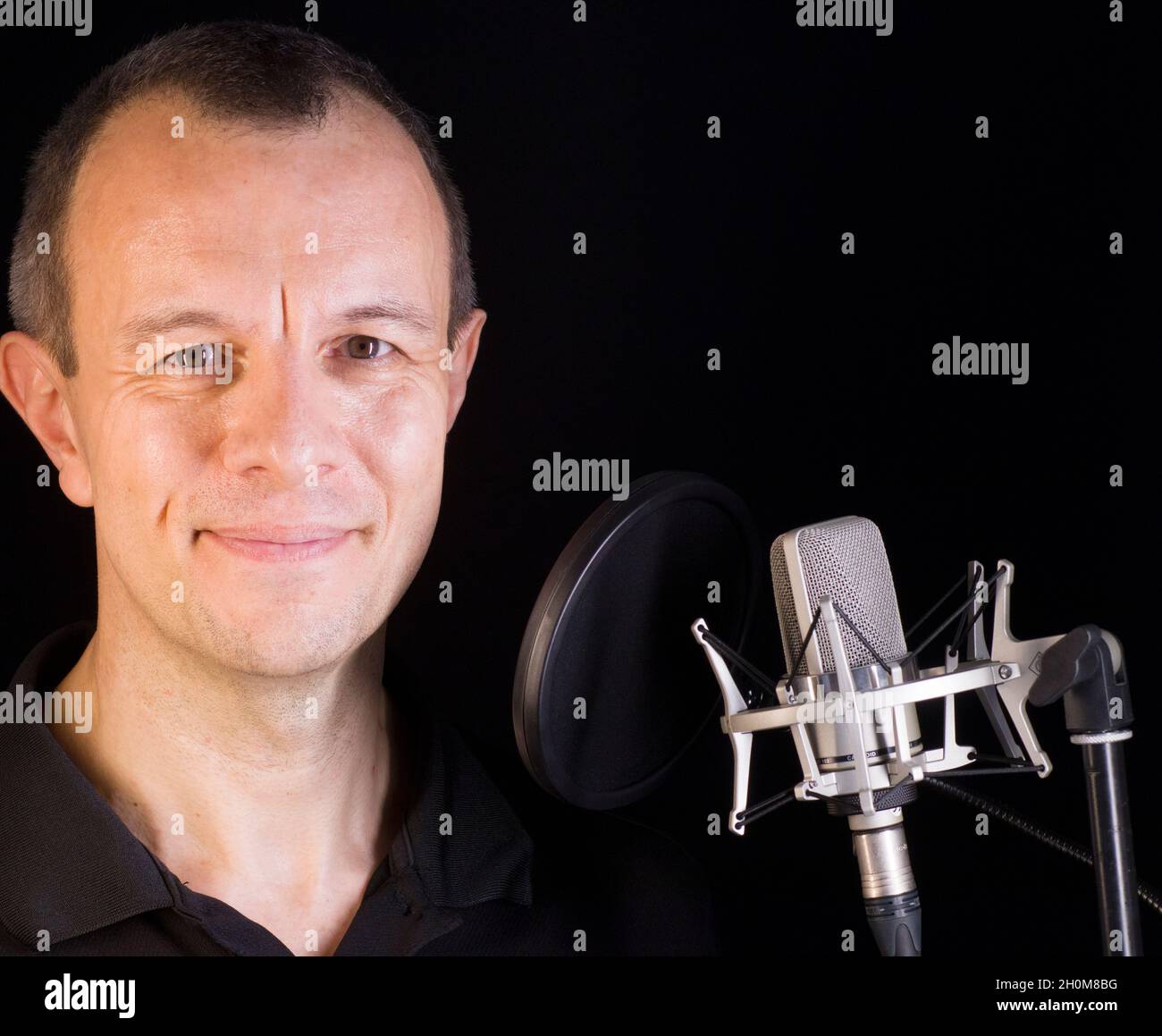 Voice over artist in booth hi-res stock photography and images - Alamy