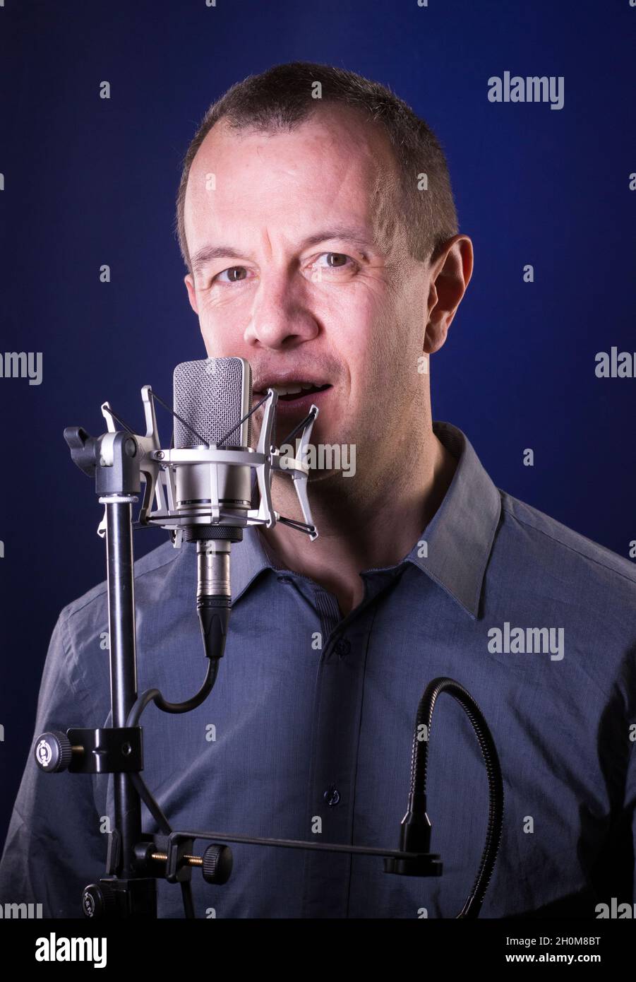 Voice over artist in booth hi-res stock photography and images - Alamy