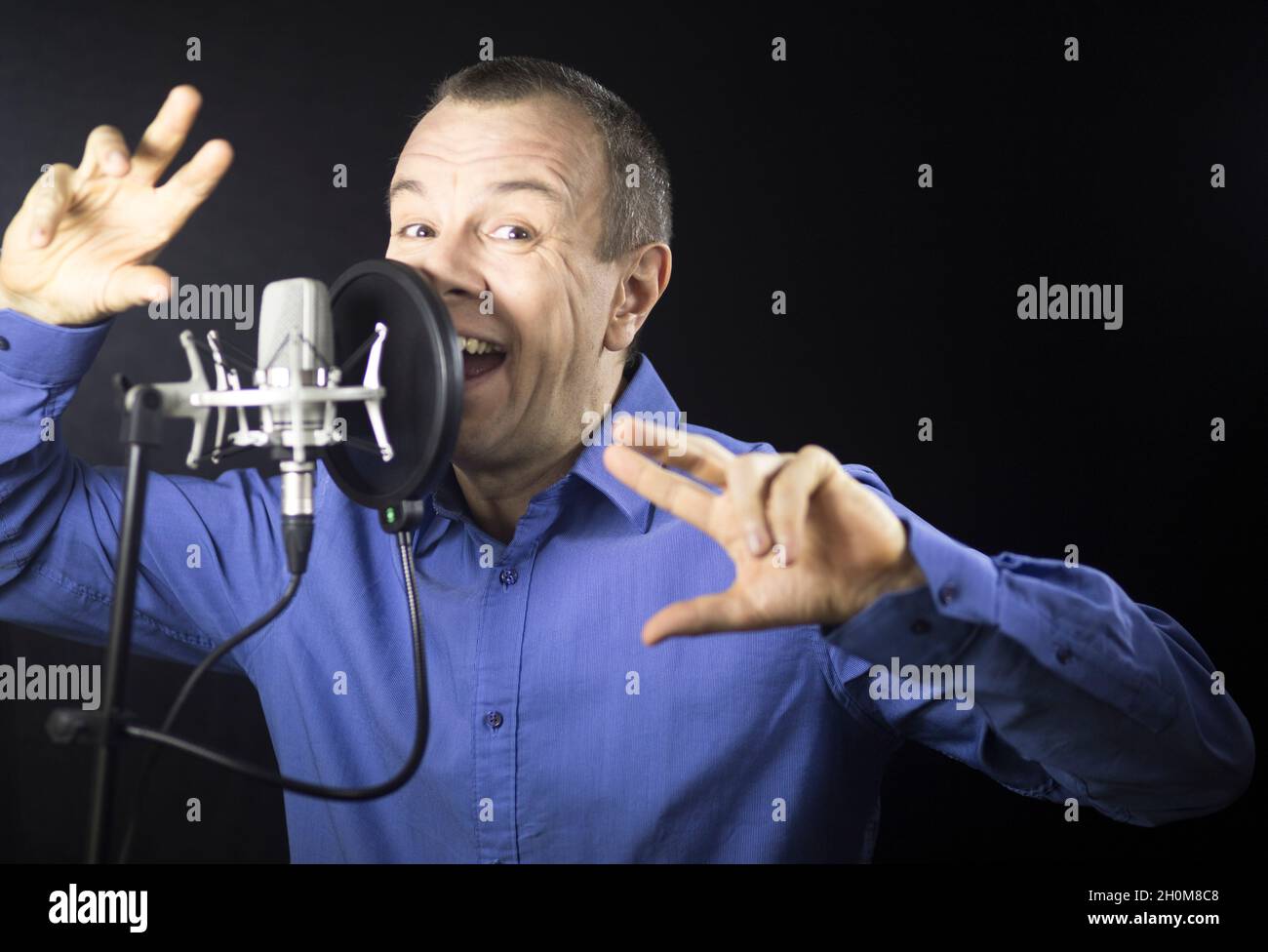Voice over artist in booth hi-res stock photography and images - Alamy