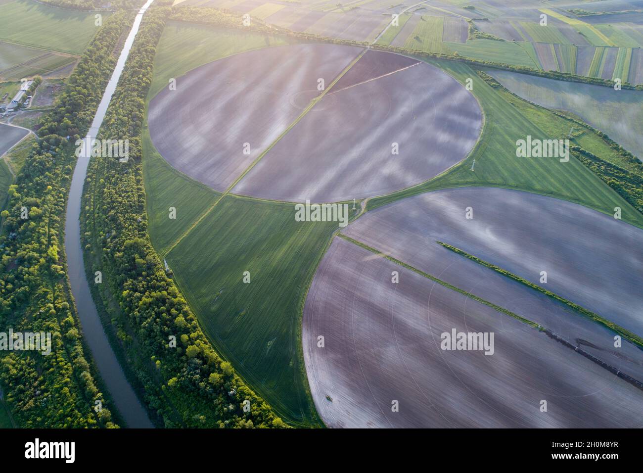 Aerial image of center pivot irrigation system working on round fields ...