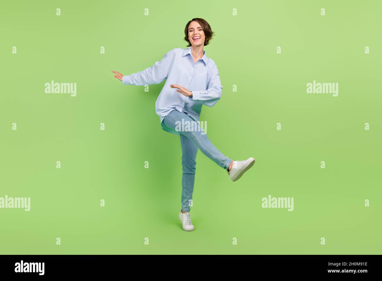 Full length photo of young woman happy positive smile have fun dance ...