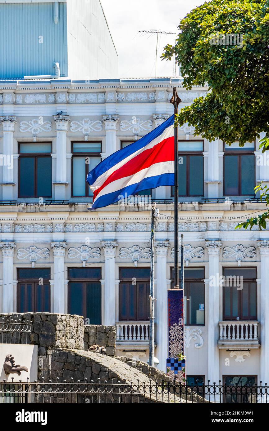 Flag of Costa Rica with old buildings behind Costa Rican flag blue ...