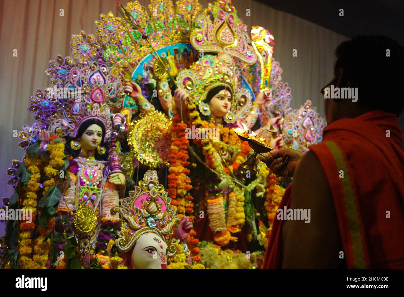 Indian People Perform Rituals in front of an idol of the Goddess Durga ...