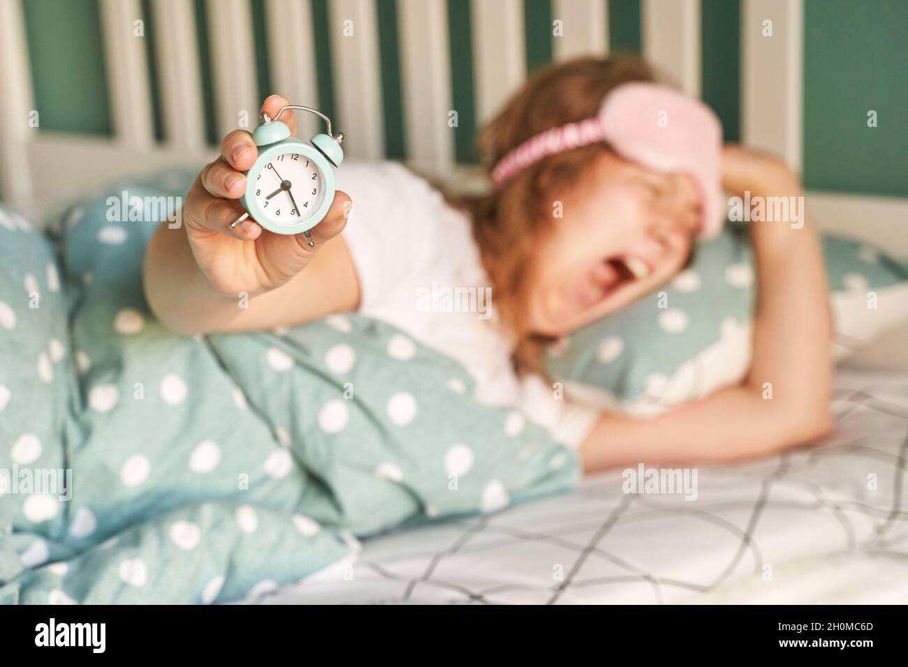 Morning routine. Young pretty woman wake up at home. Bed time. Snooze ...