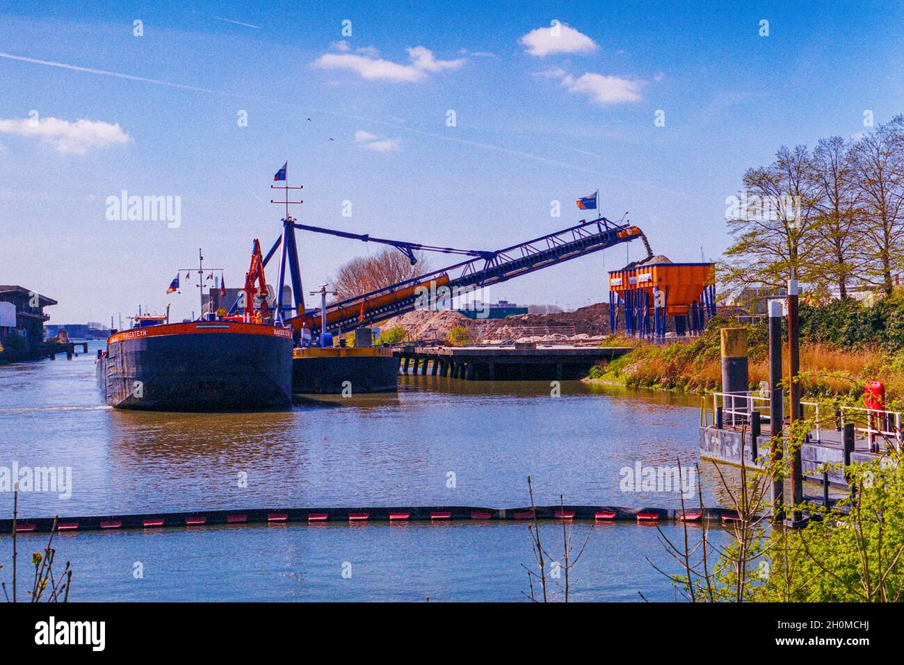 Rotterdam, Netherlands. Inland Barge Vessel unloading it's Bulk Cargo ...