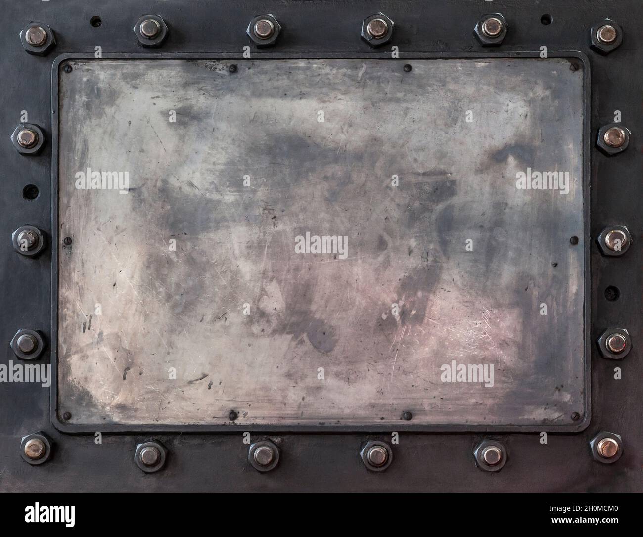 Worn industrial metal plate with bolts as a frame Stock Photo - Alamy