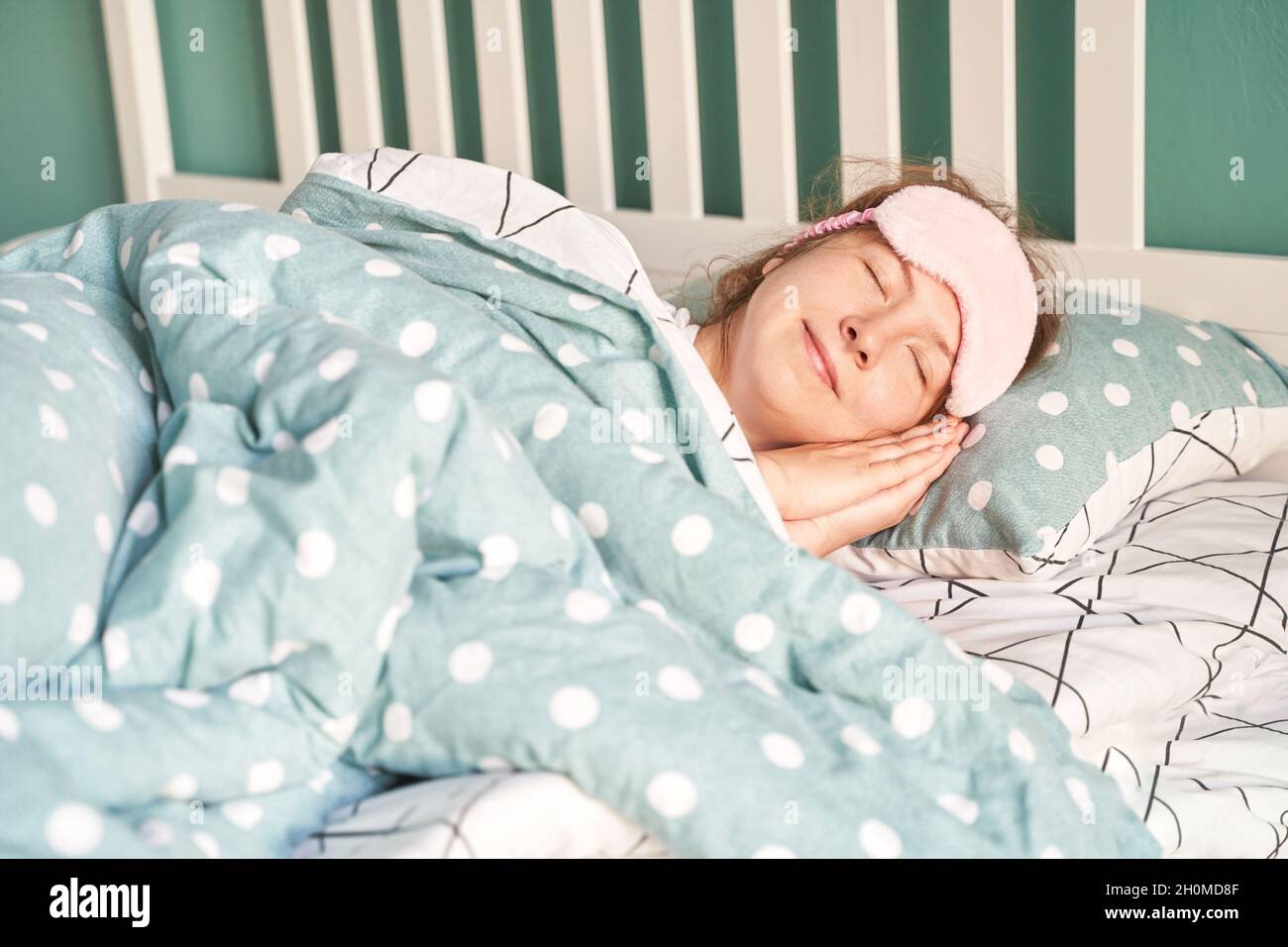 Morning routine. Young pretty woman wake up at home. Bed time. Snooze ...