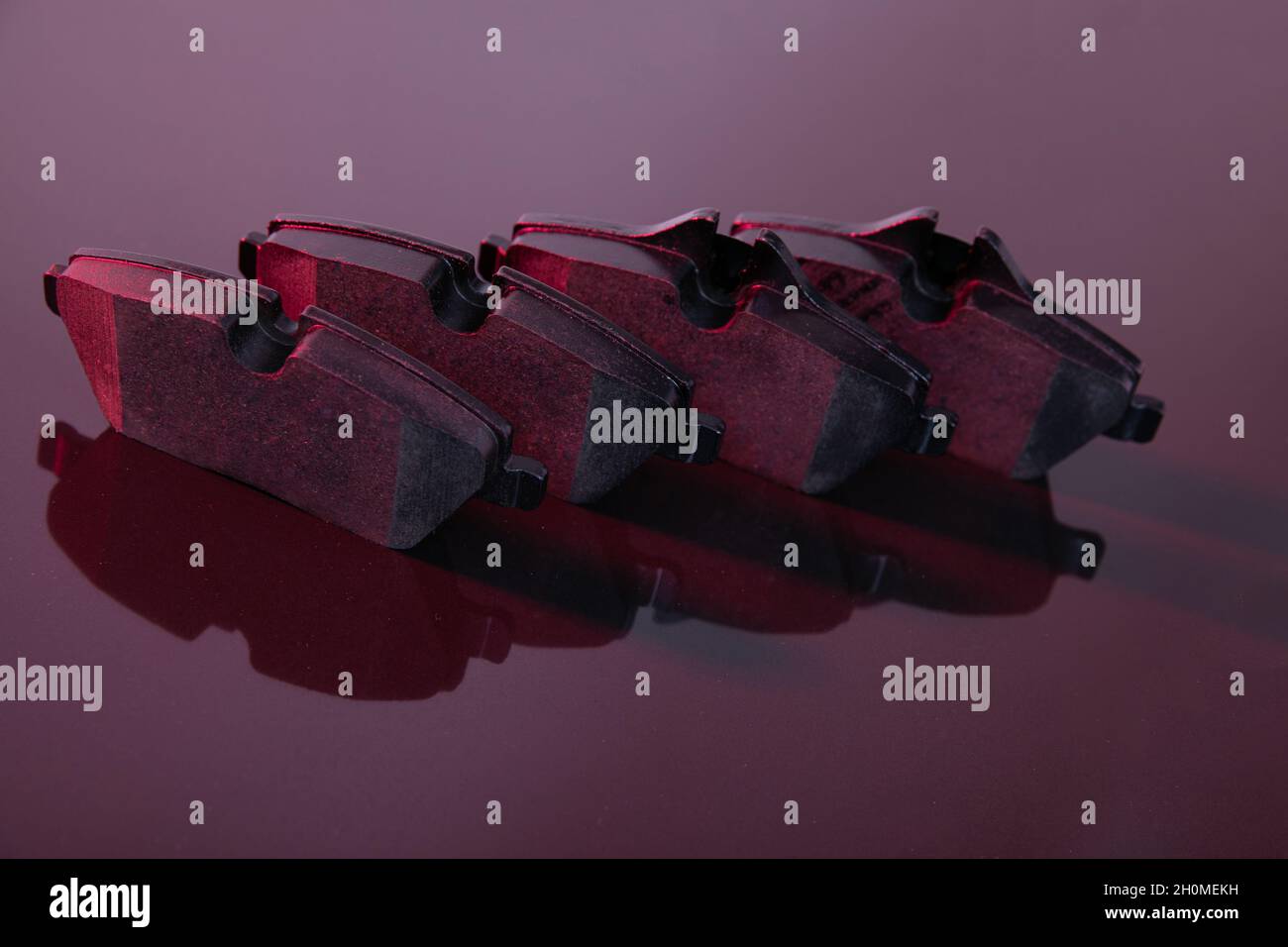 set of car brake pads for car safety on stylish red background Stock ...