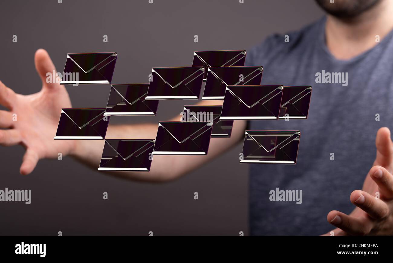 Hands holding 2D mail icons Stock Photo - Alamy