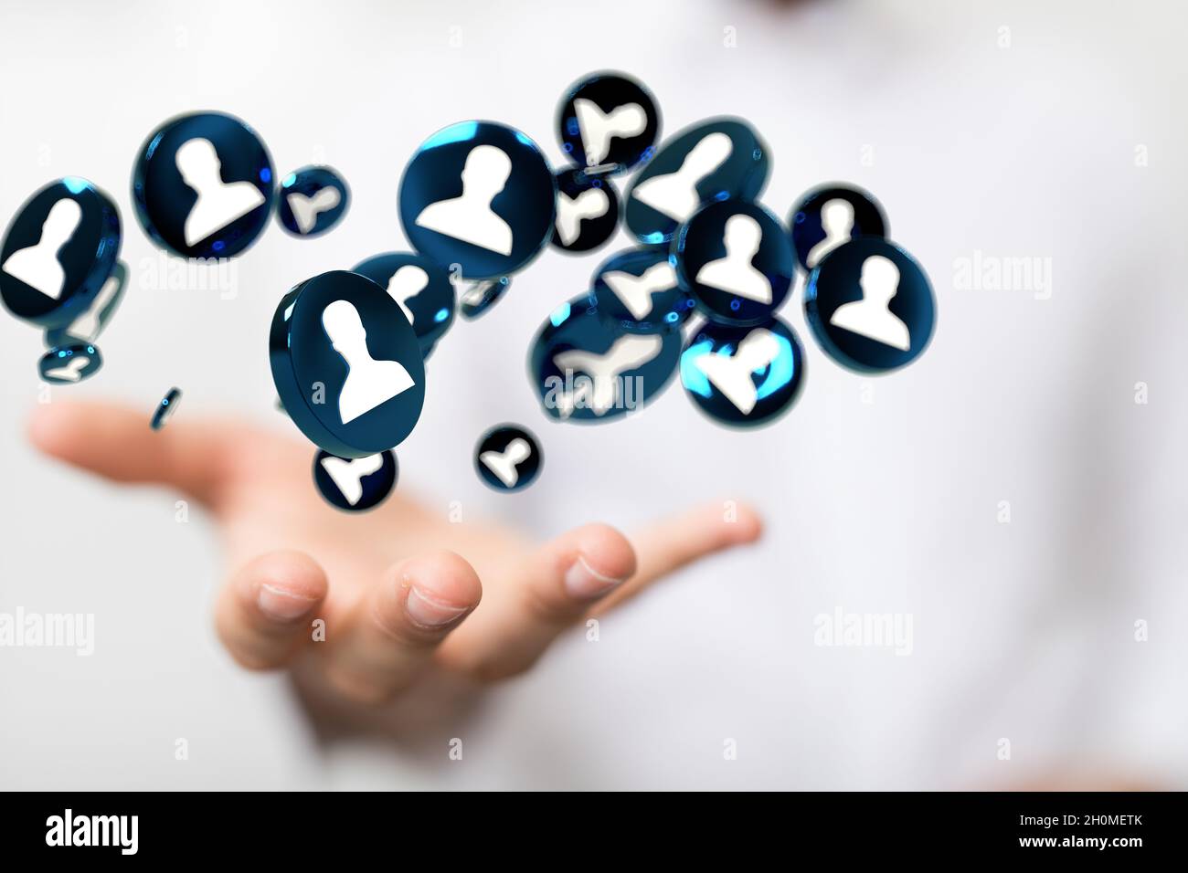Hand with 2D people icons Stock Photo - Alamy