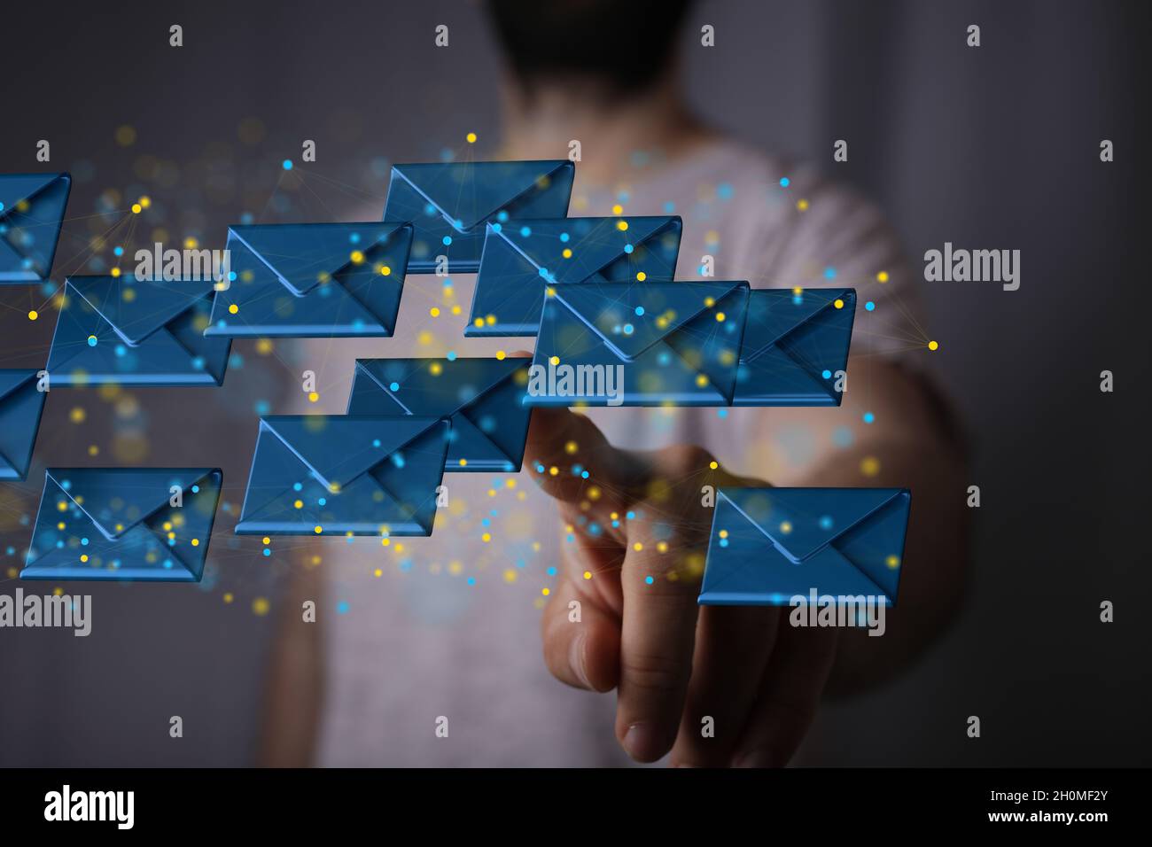 Hand tapping rendered mail icons Stock Photo - Alamy