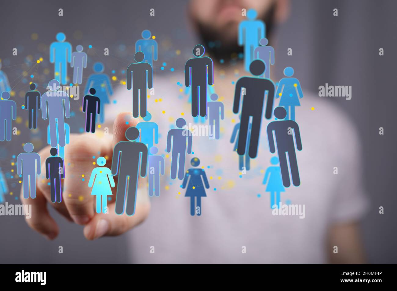 Hand holding 2D people icons Stock Photo - Alamy