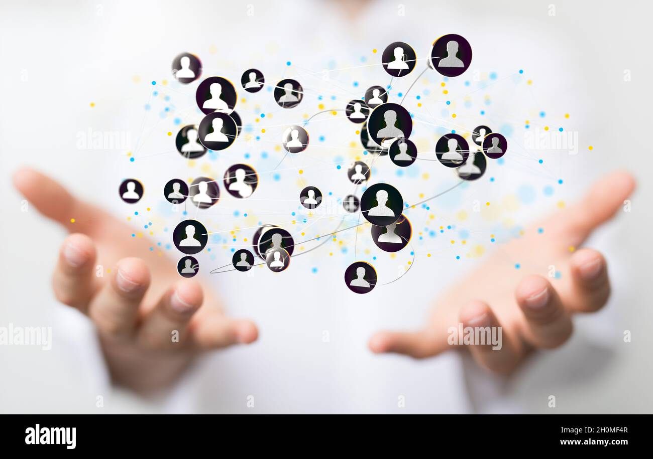 Hand holding 2D people icons Stock Photo - Alamy