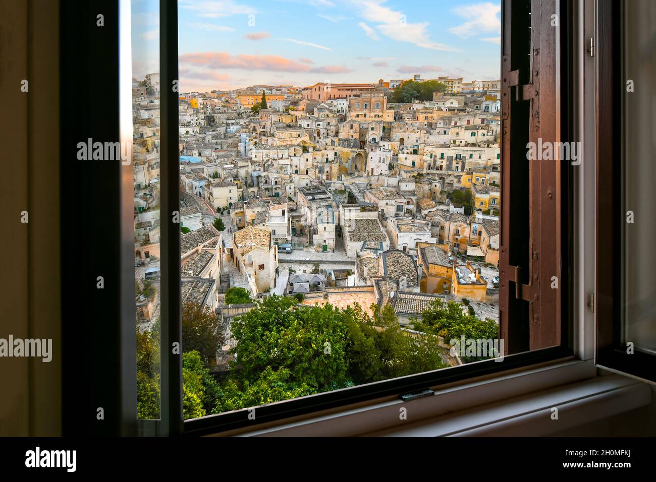View out of an open window overlooking the ancient sassi and village of ...