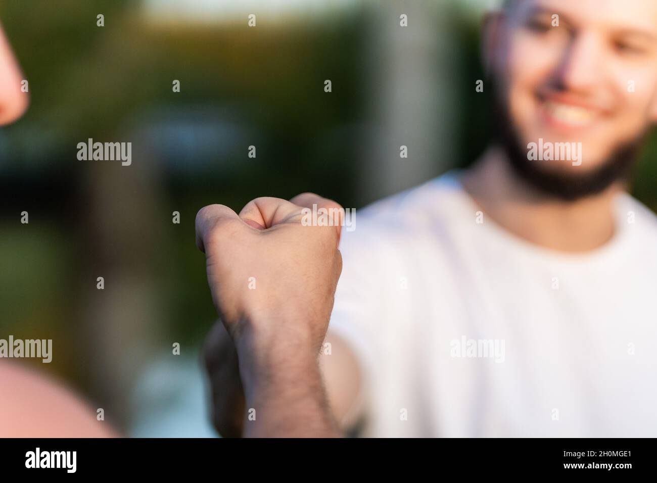 Fist clash greeting hi-res stock photography and images - Alamy