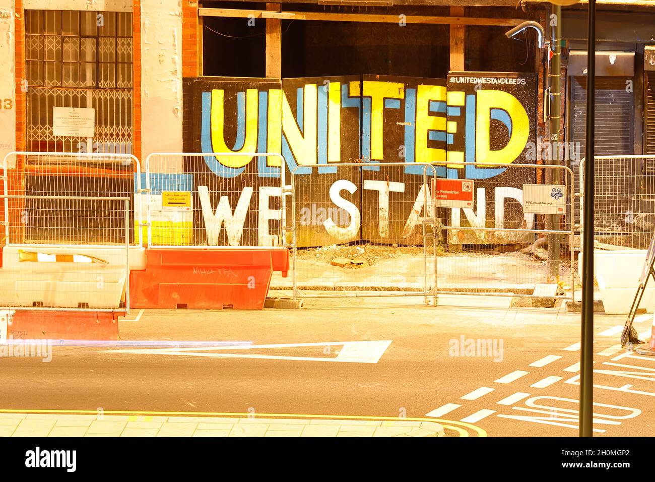 A Leeds United mural in leeds City Centre that reads "United We Stand ...