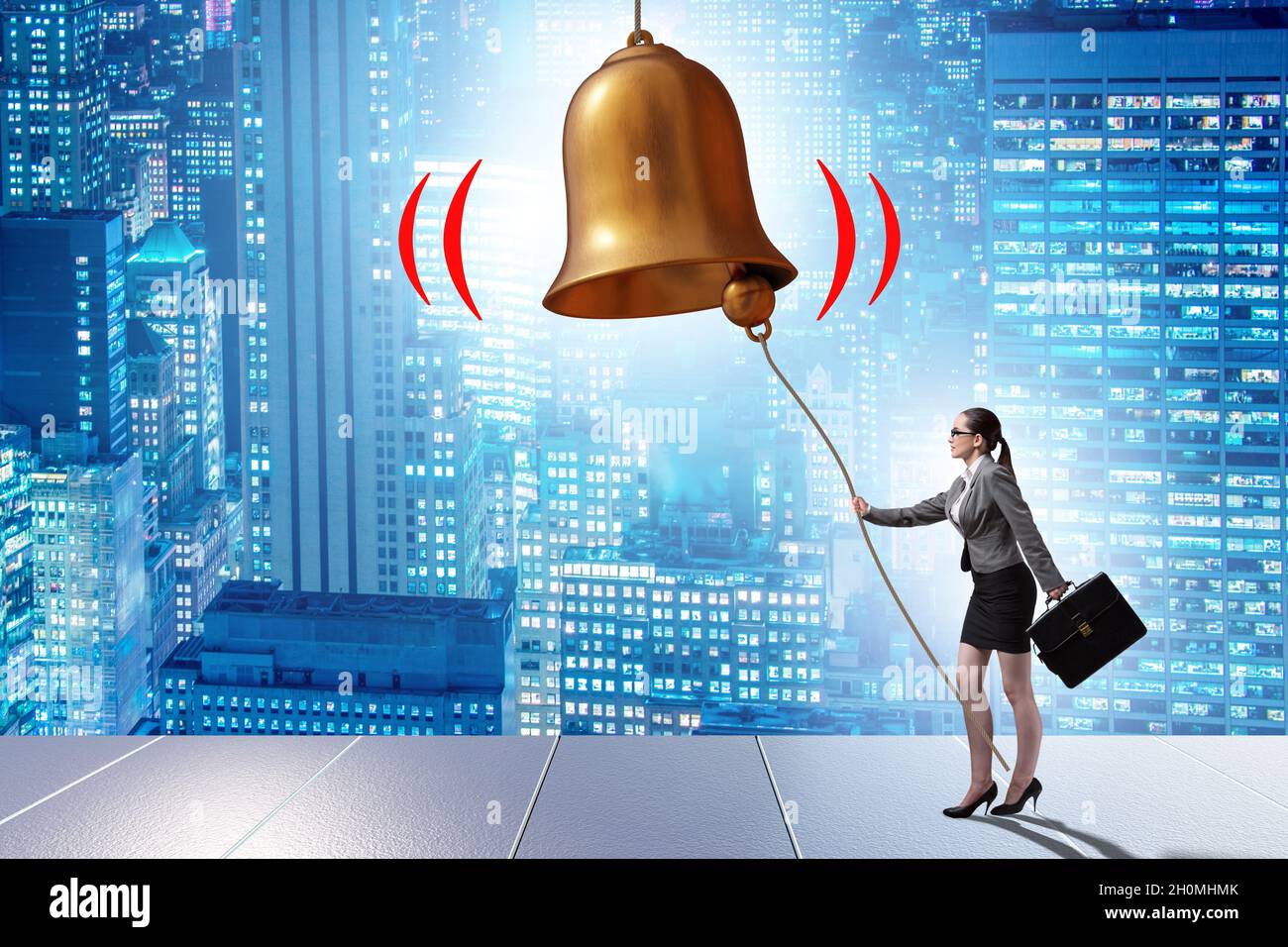 Businesswoman ringing the bell in case of the danger Stock Photo - Alamy