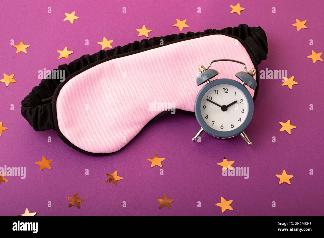 Mask for sleep and alarm clock near it.Circadian rhythms concept Stock ...
