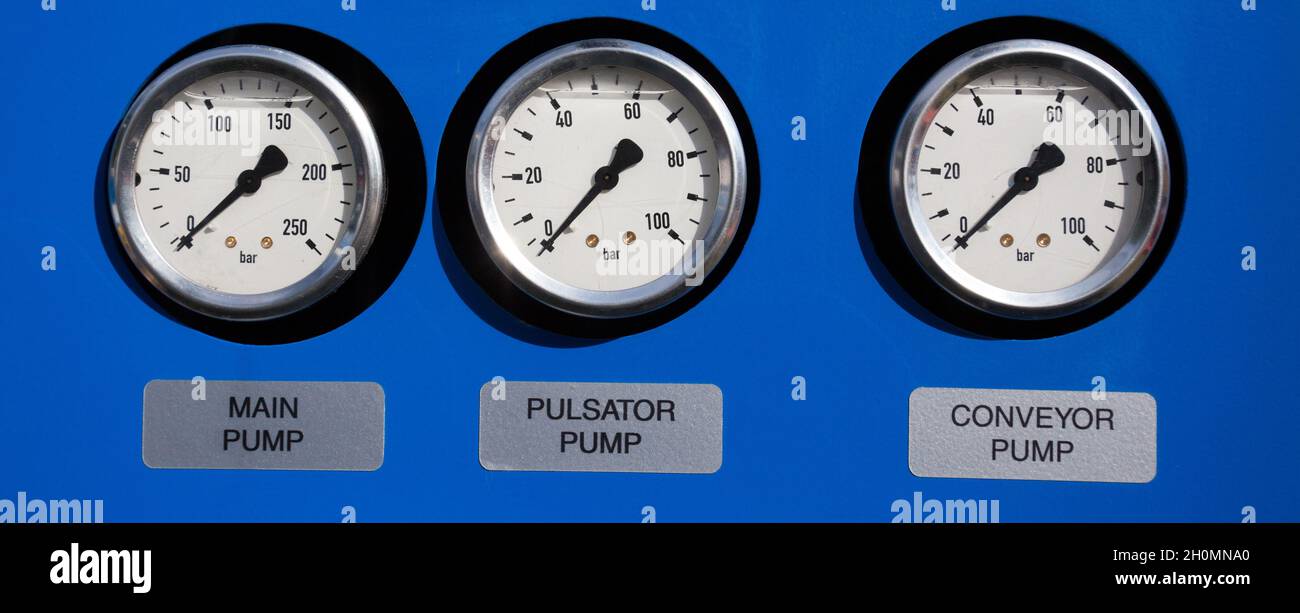 Three barometers of industry pump on blue metal dashboard Stock Photo ...