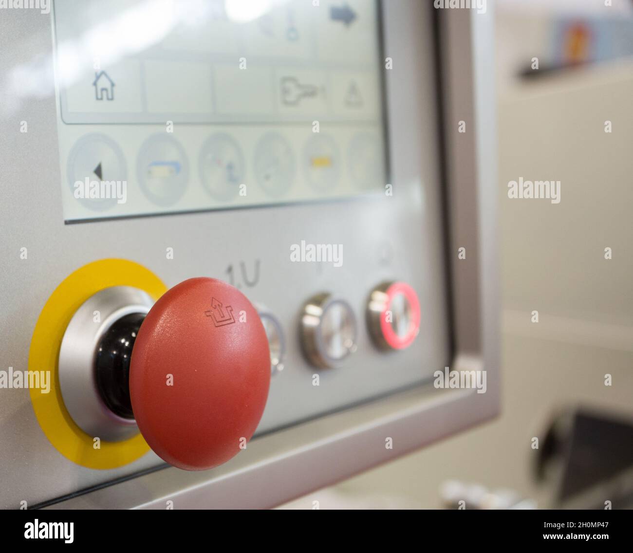 Red button and touch screen display on the machinery in food industry ...