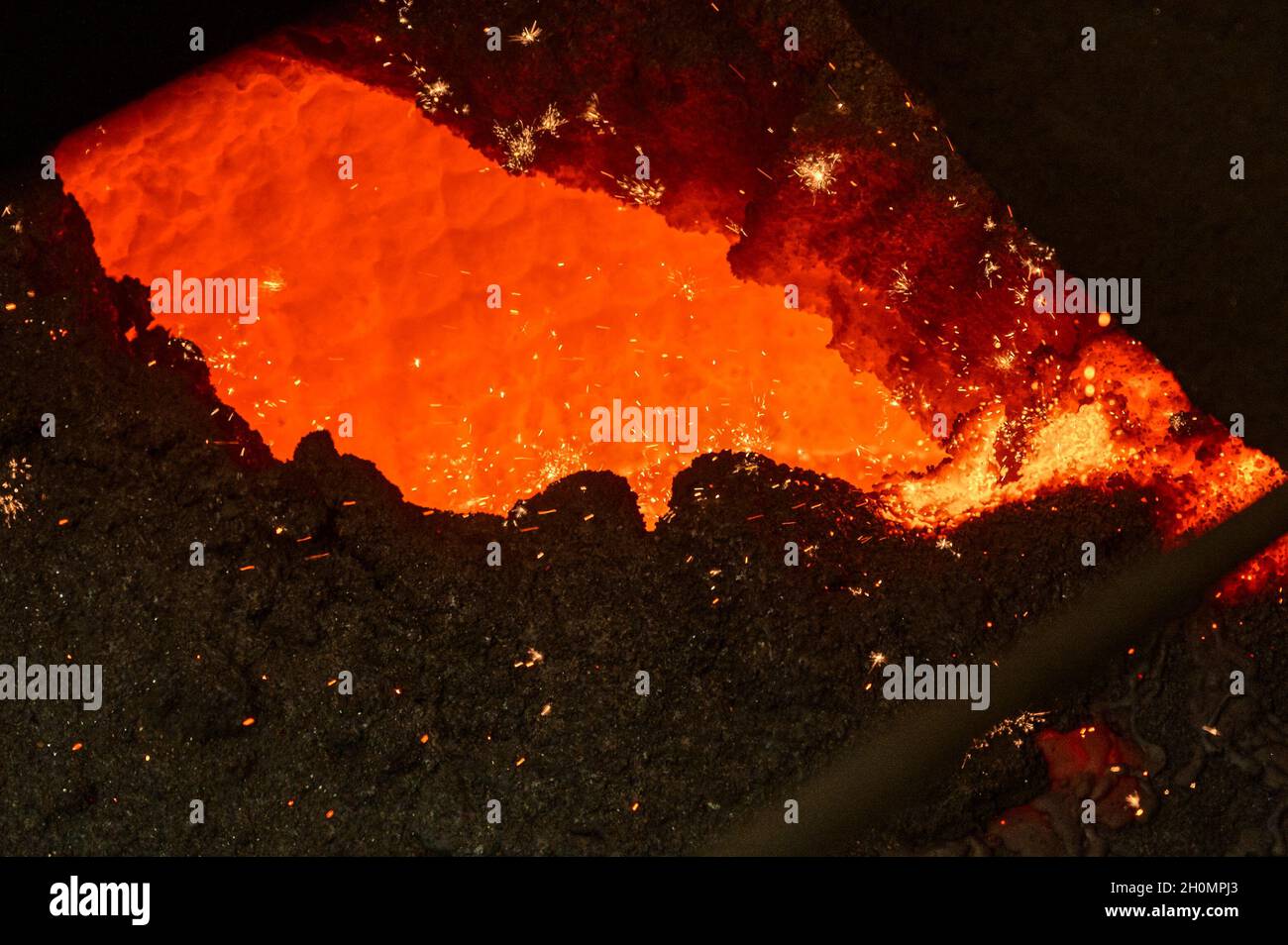 The hot inner surface of the metallurgical ladle. A hole in a thick ...