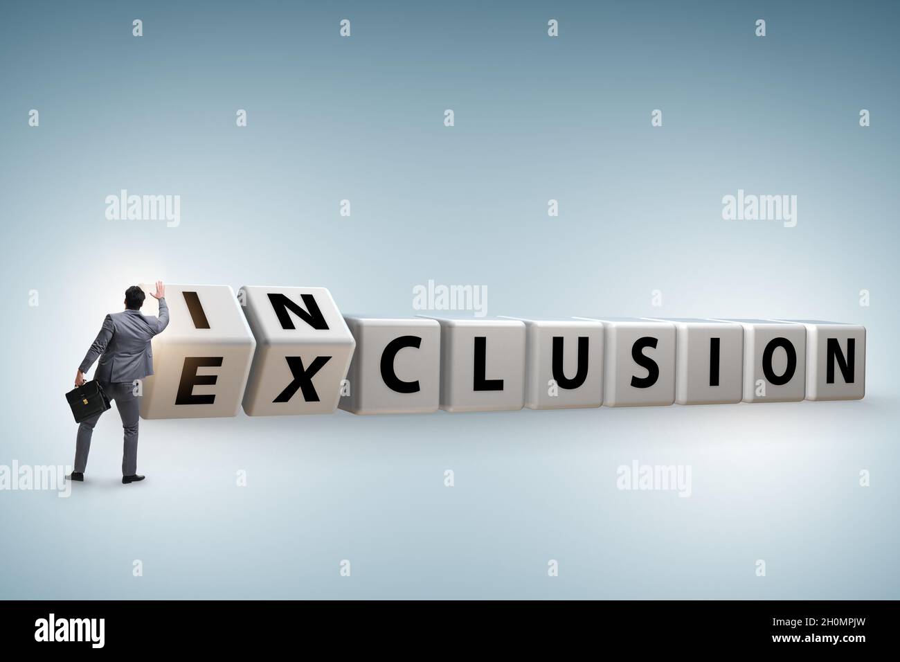 Businessman turning cubes in the inclusion and exclusion concept Stock ...