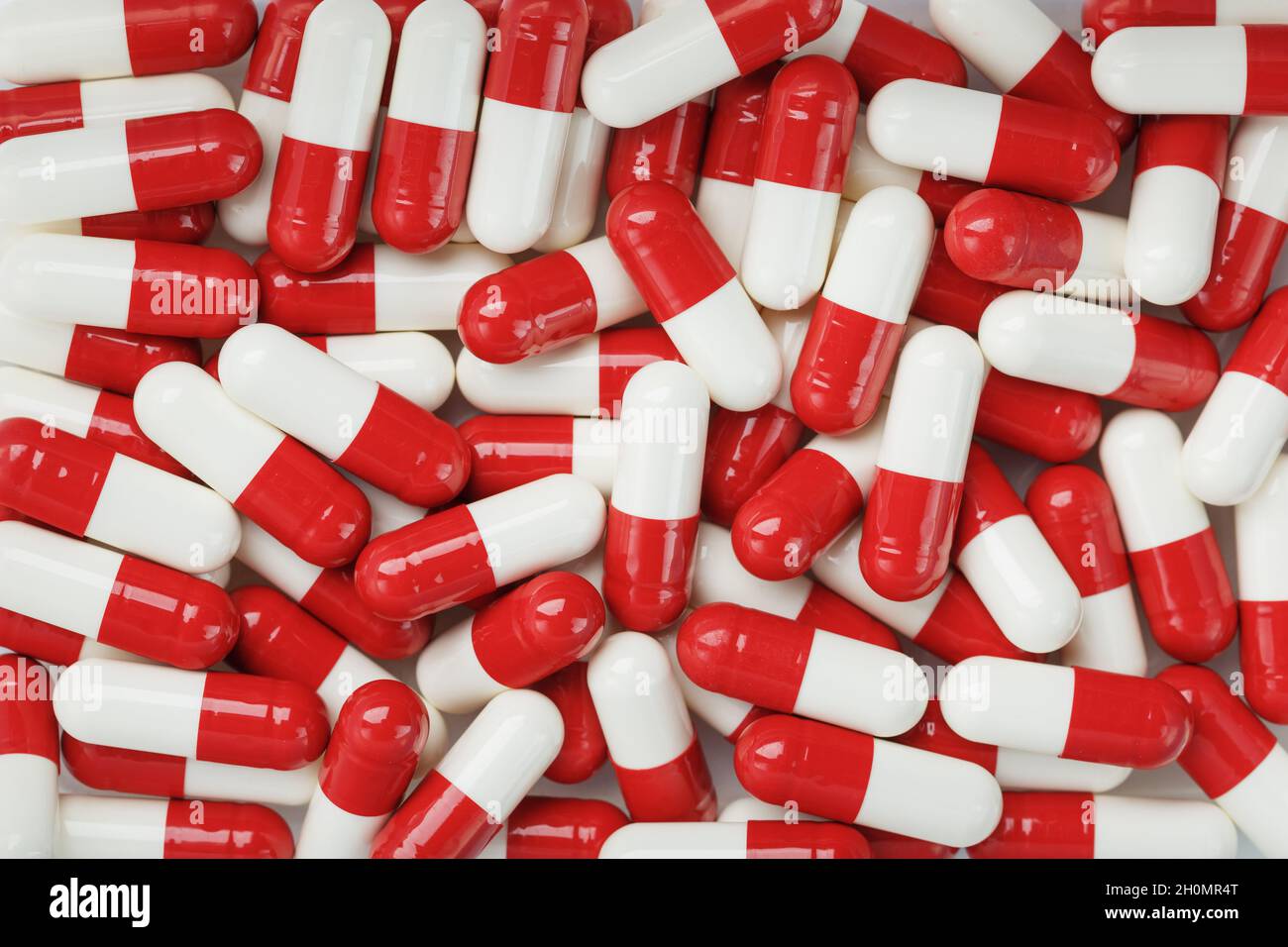 Medical medicinal Pills capsules are white and red in color as a ...