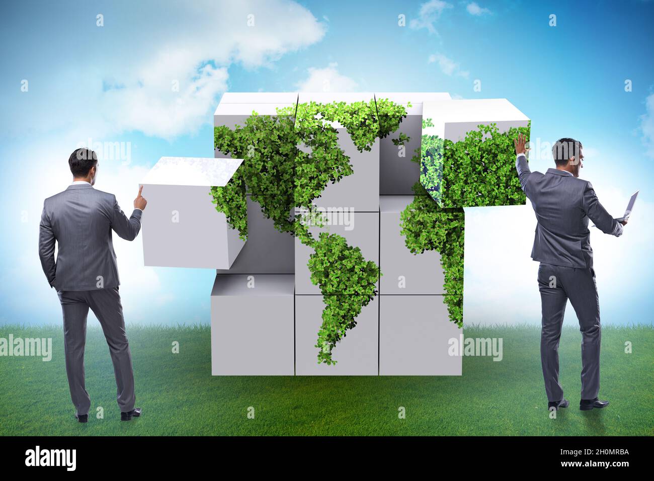 Businessman building world map from the cubes Stock Photo - Alamy
