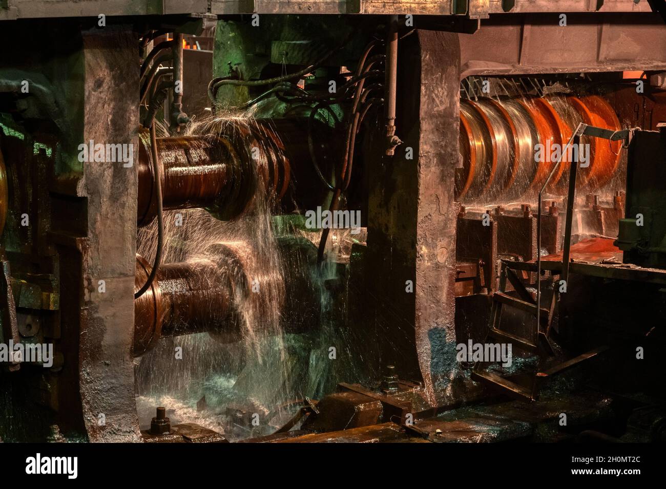 The process of rolling hot rolled steel in a rolling mill Stock Photo ...