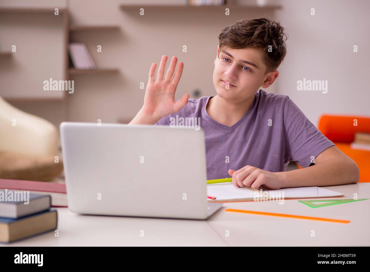 Male pupil preparing for exams at home Stock Photo - Alamy